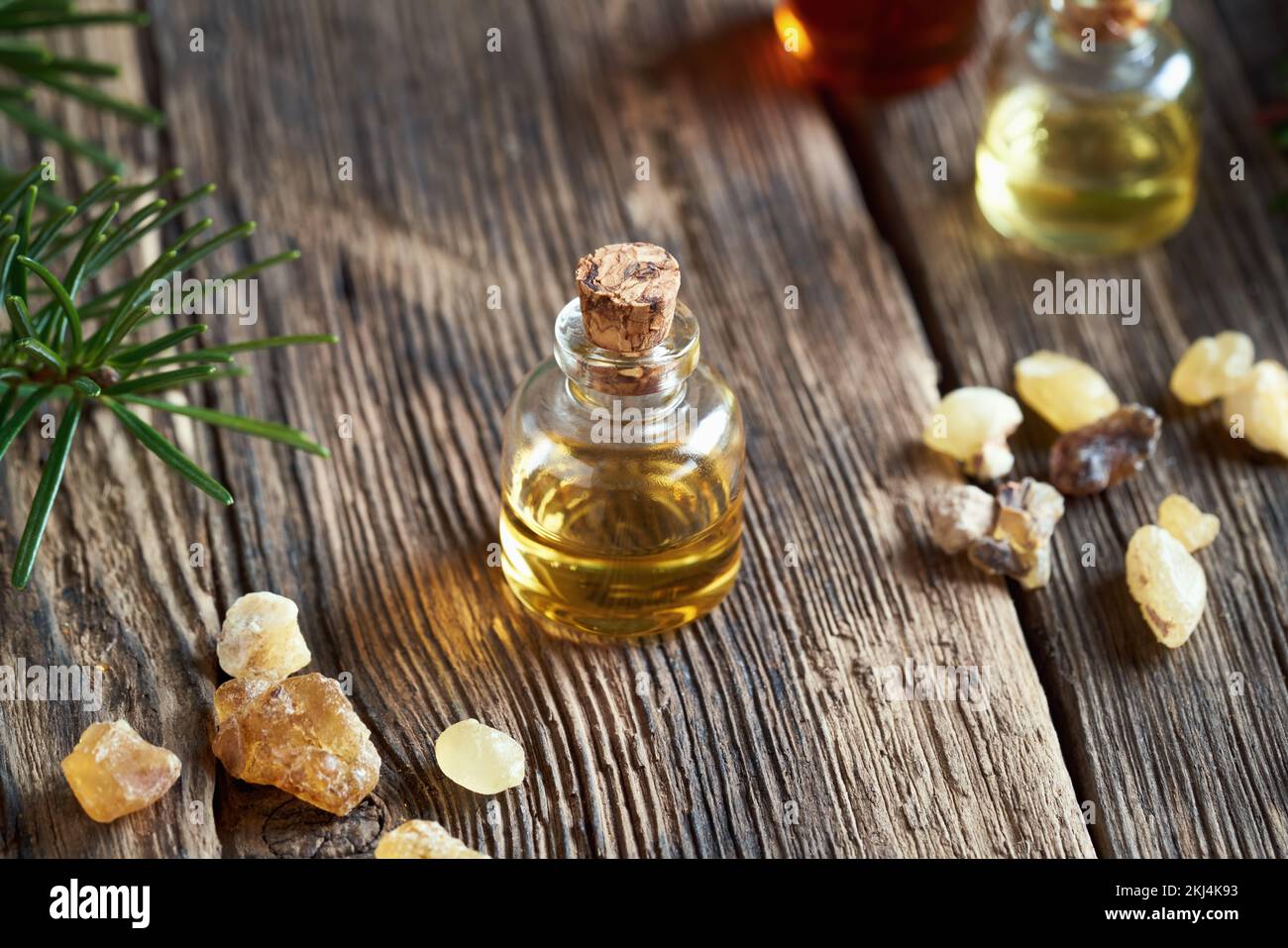 A transparent bottle of frankincense essential oil with boswellia resin ...