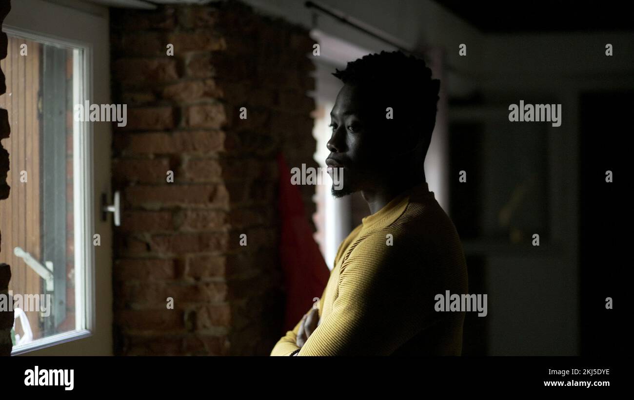 Concerned biracial man sitting hi-res stock photography and images - Alamy