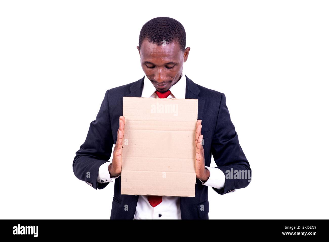 a businessman standing on a white background presenting an empty paper ...