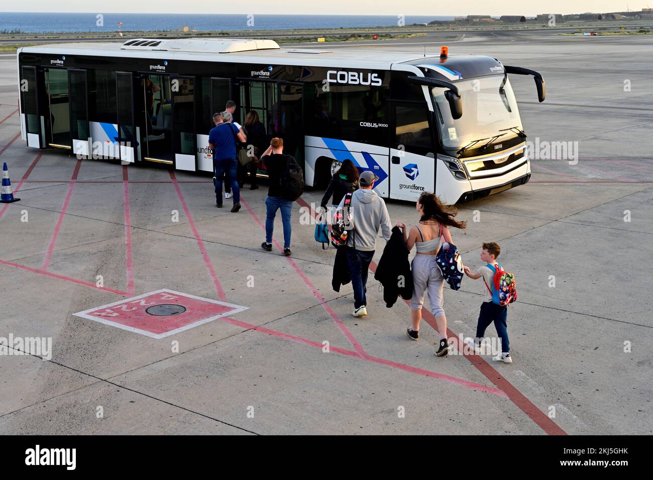 Airport shuttle to transport passengers from plane to terminal Stock ...