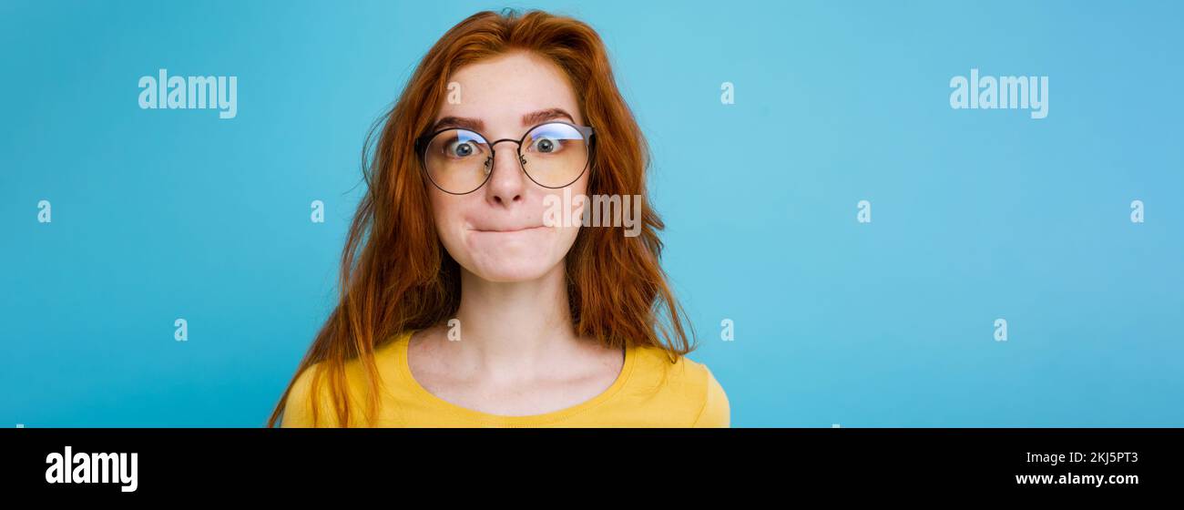 Headshot Portrait of happy ginger red hair girl with funny face looking ...