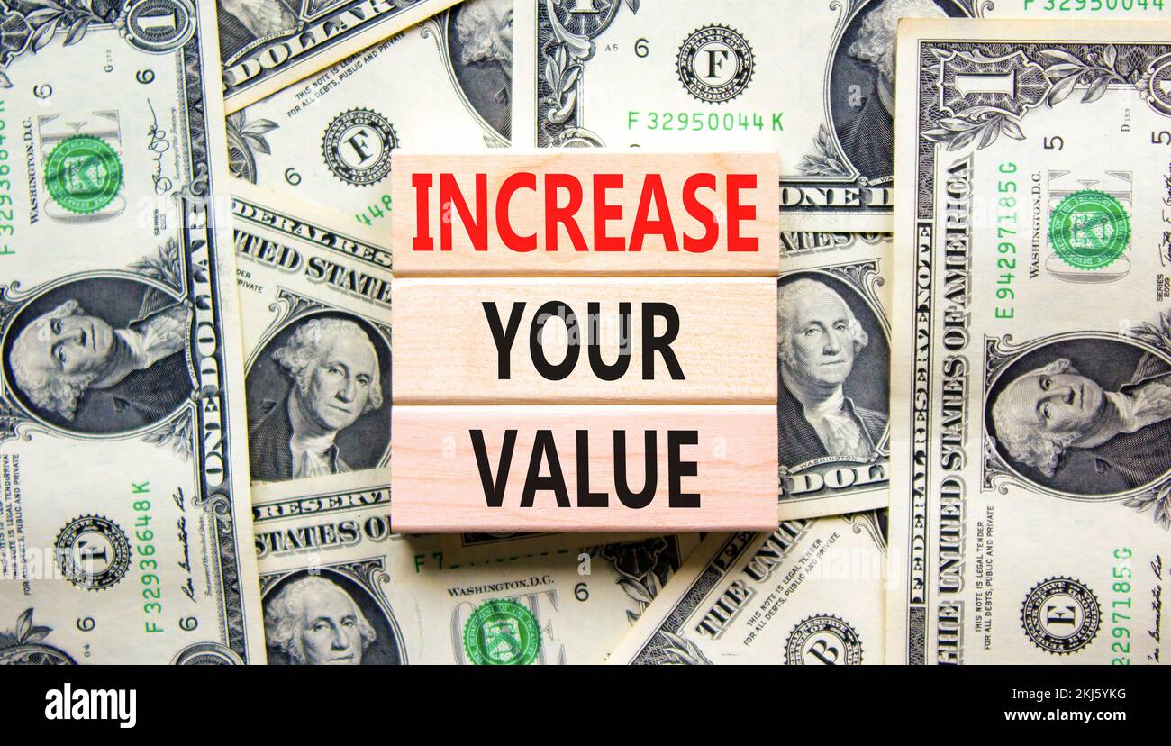 Increase your value symbol. Concept words Increase your value on wooden ...