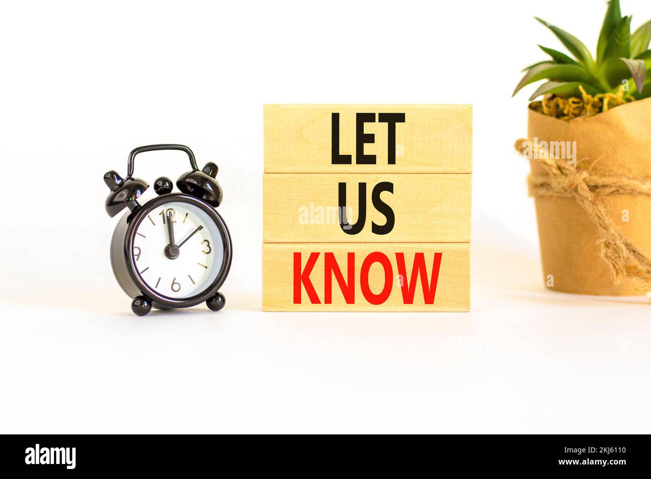 Let us know symbol. Concept words Let us know on wooden blocks on a ...