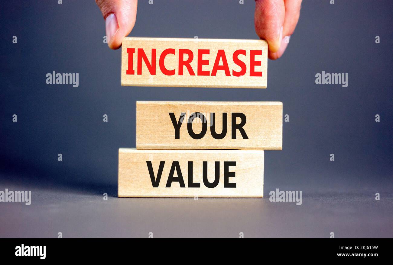 Increase your value symbol. Concept words Increase your value on wooden ...