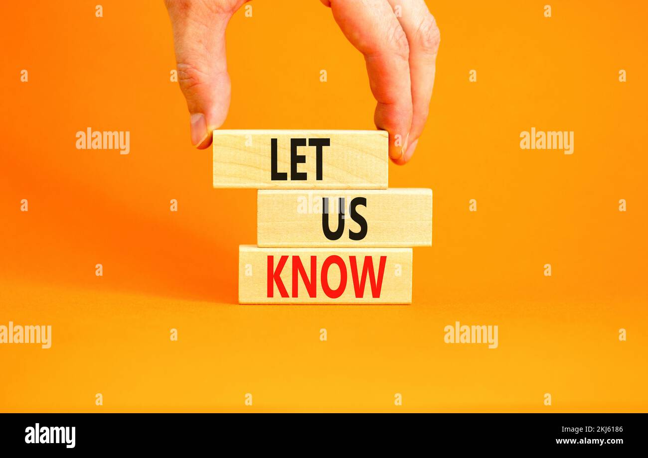 Let us know symbol. Concept words Let us know on wooden blocks on a ...