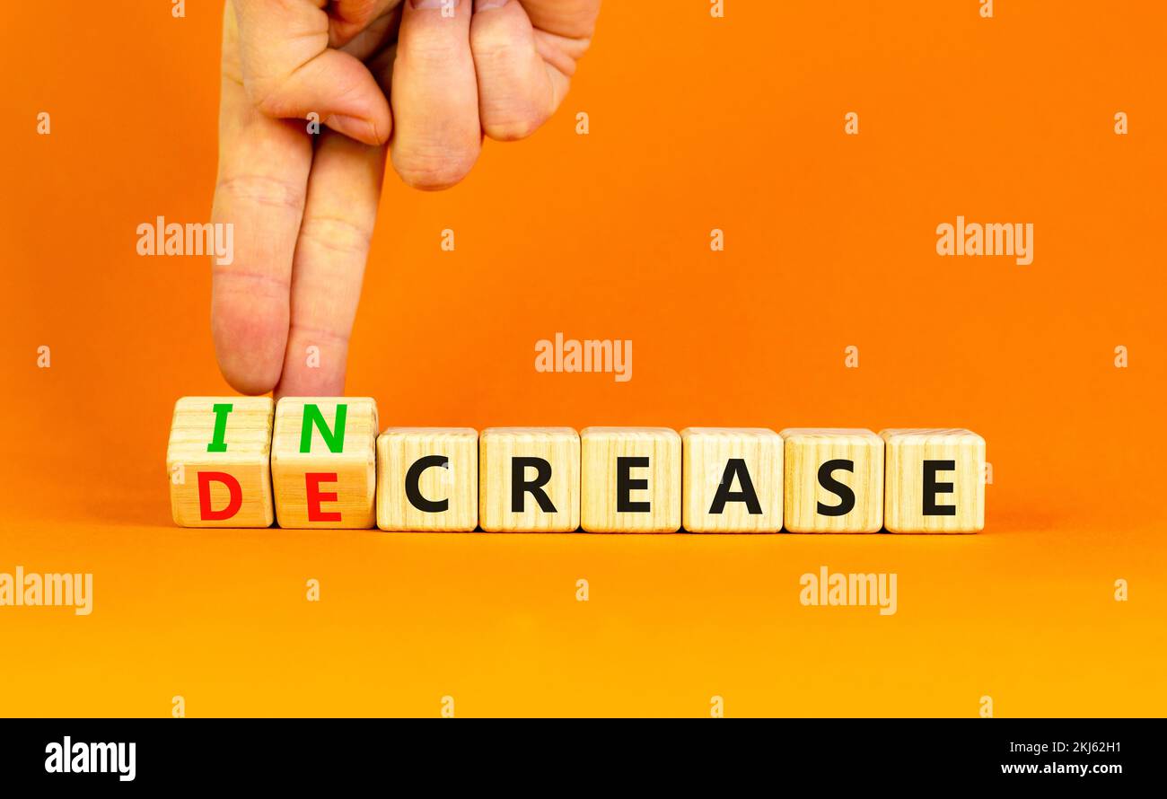 Increase or decrease symbol. Concept words Increase and Decrease on wooden cubes. Businessman ...