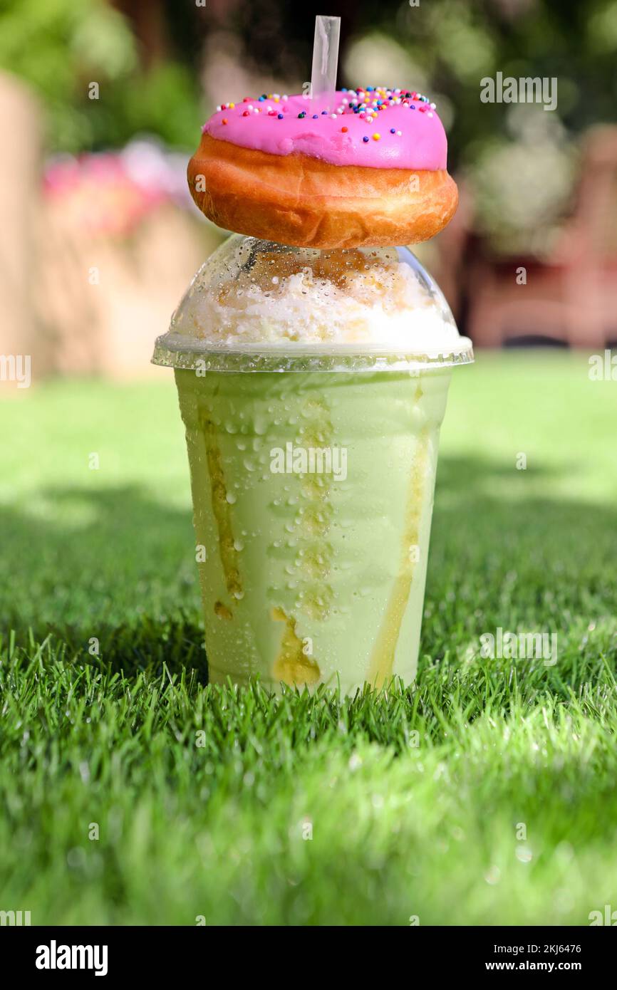 Pictures of some juices and smoothies with donuts Stock Photo - Alamy