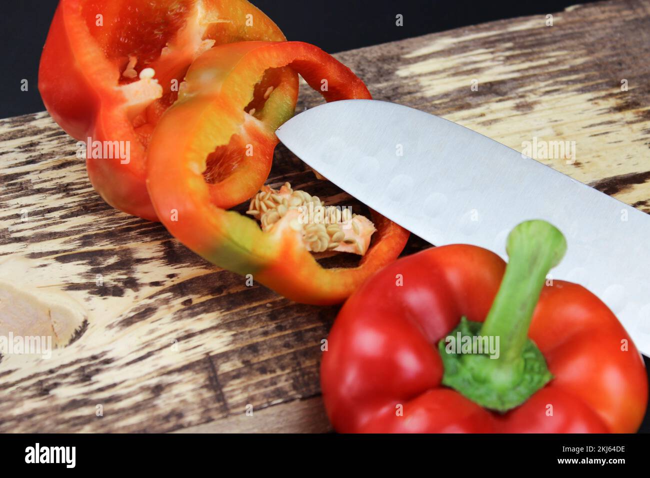 Close-Up Of pepper On Wooden Cutting Board. Concept for healthy ...