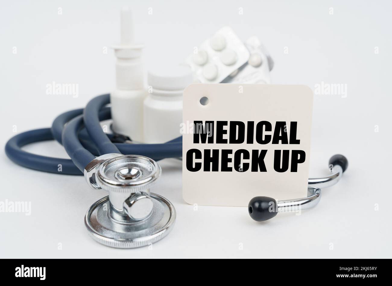 Medical concept. On a white surface, medicines, a stethoscope and ...