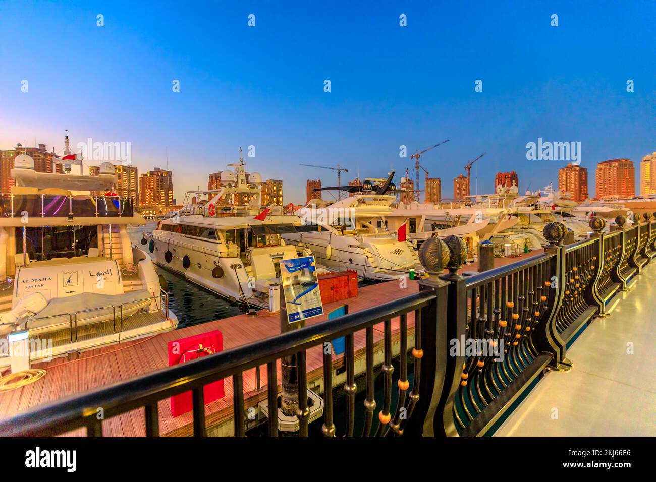 Doha, Qatar - February 17, 2019: Luxurious yachts and boats docked at ...