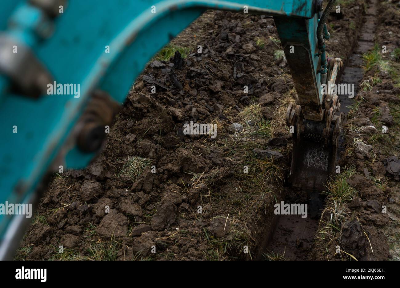 Close up of excavator or digger digging some a soil or clay, industrial ...