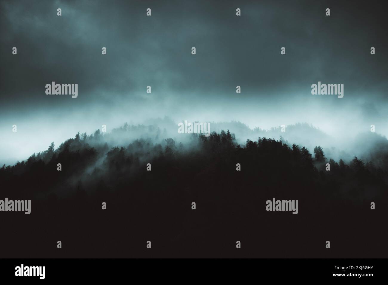 Misty silhouette forest and mountain of Rara Lake in Rara National Park ...