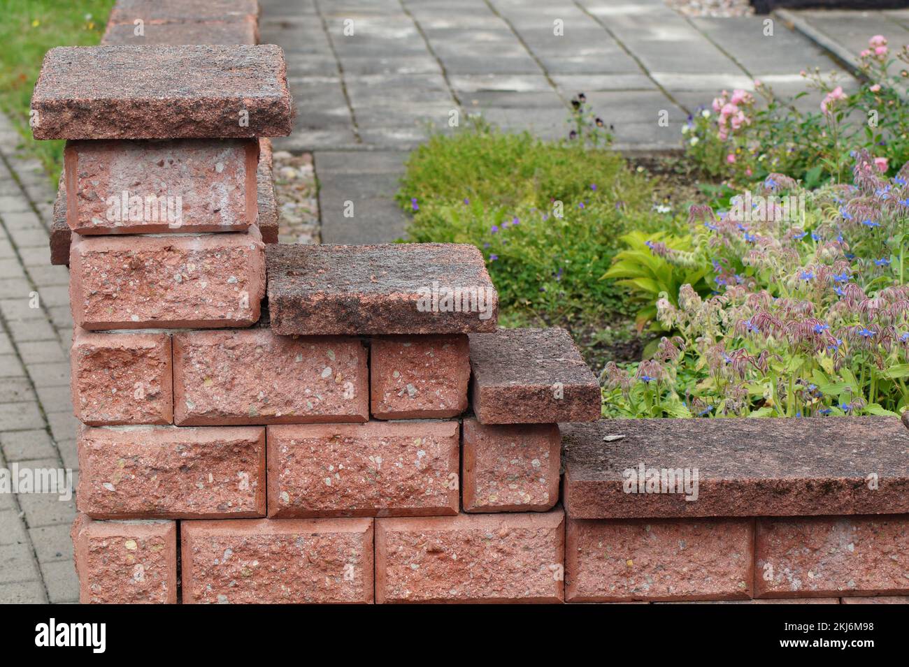 small wall as the property line Stock Photo - Alamy