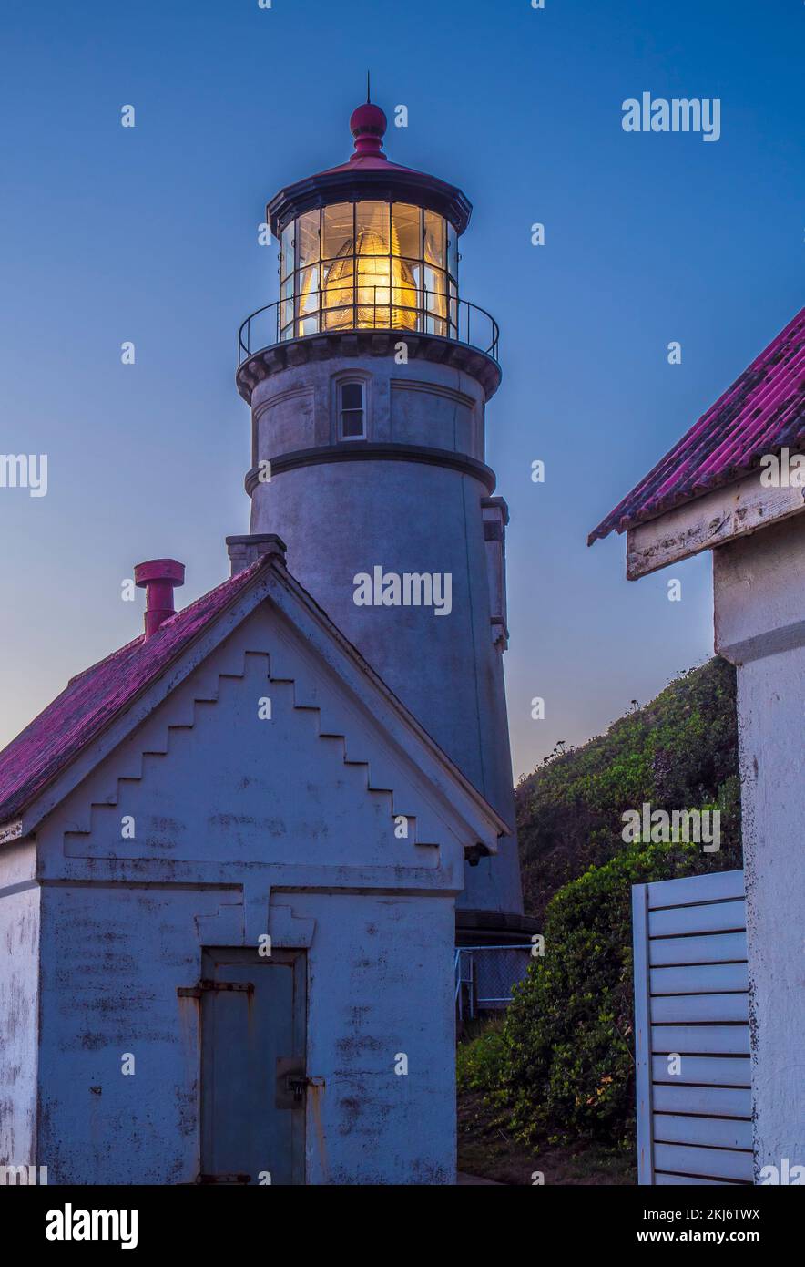 Heceta Head Lighthouse shining at twilight Stock Photo - Alamy