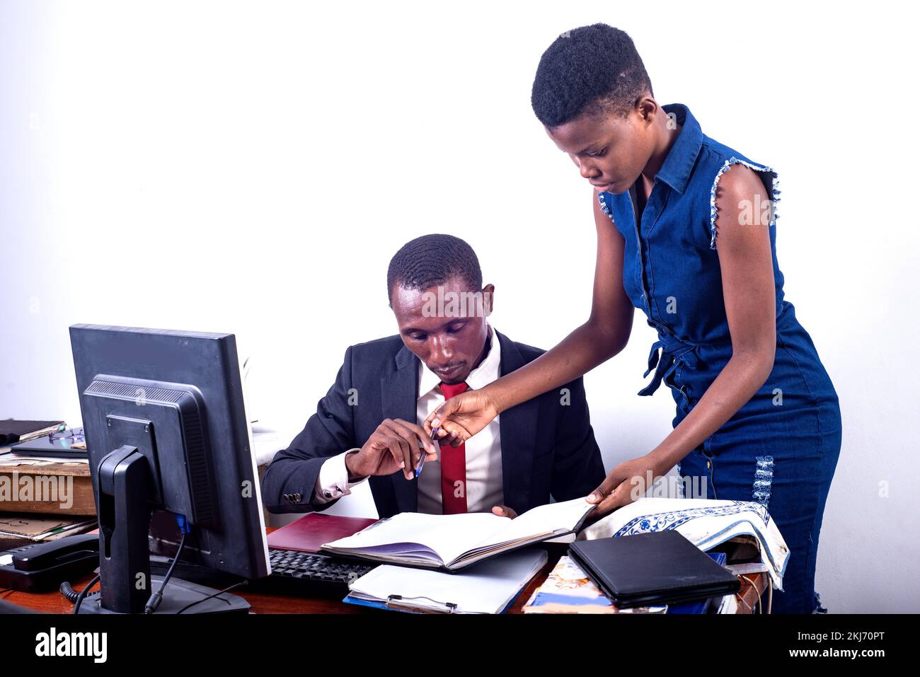 young secretary girl giving the signing contract to her boss to sign at ...