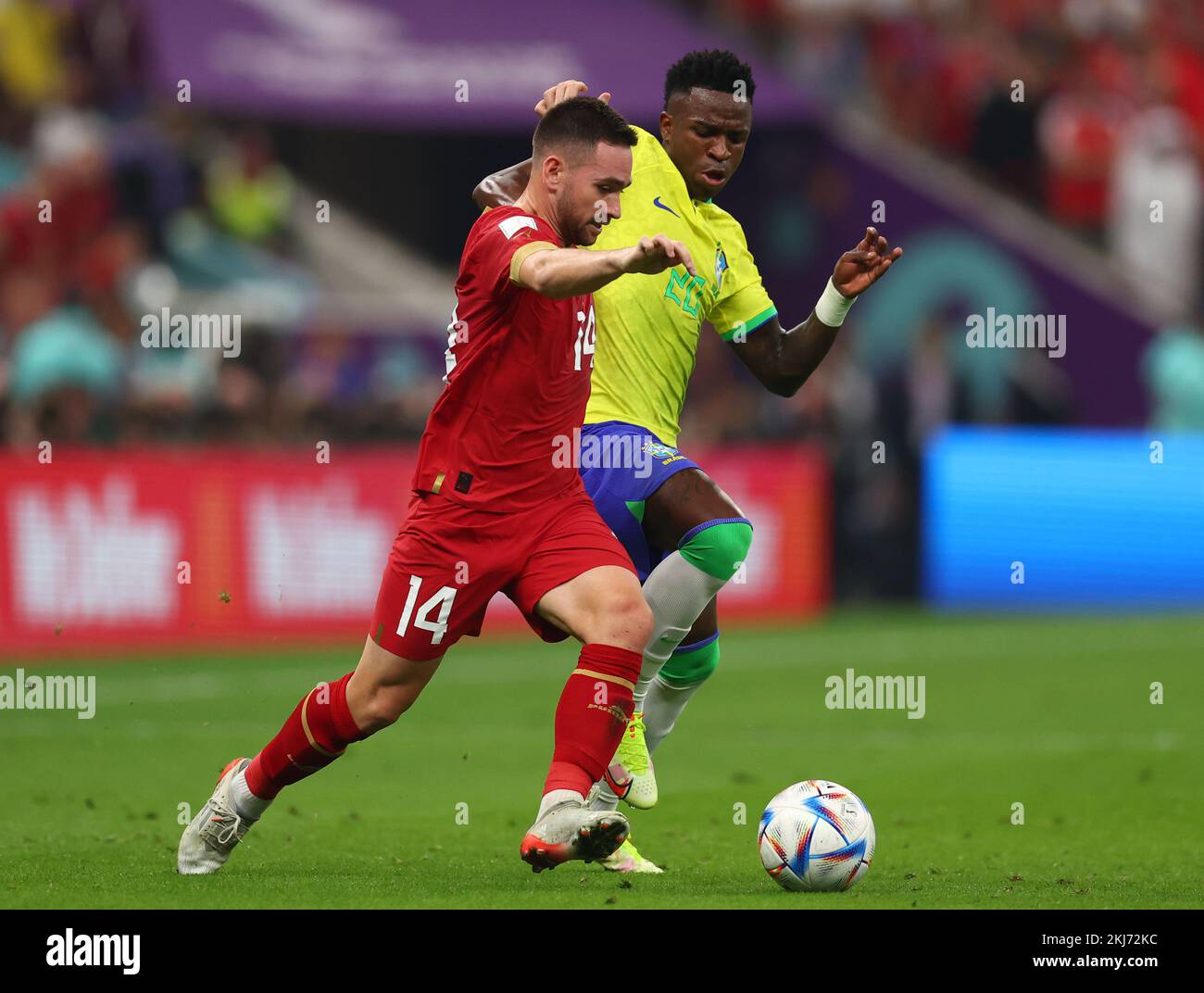 Doha, Qatar, 24th November 2022. Andrija Zivkovic of Serbia holds off ...