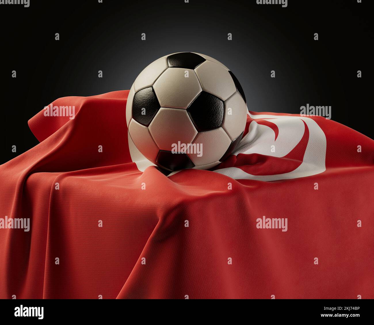 A regular soccer balls resting on a Tunisia flag draped over a plinth ...