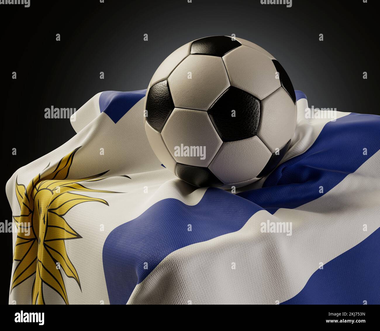 A regular soccer balls resting on a Uruguay flag draped over a plinth ...