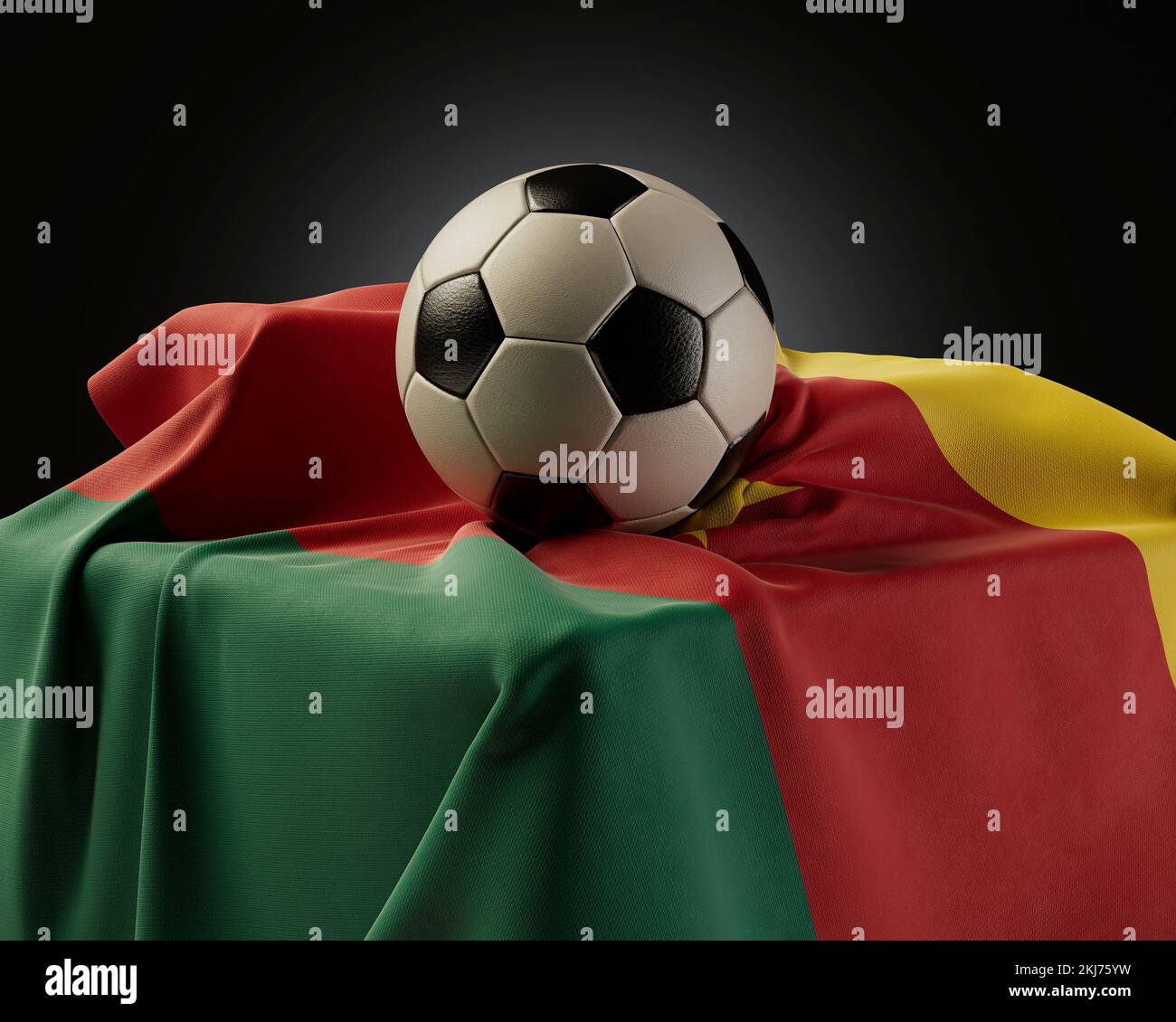 A regular soccer balls resting on a Cameroon flag draped over a plinth ...