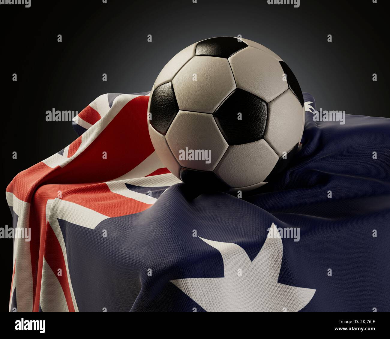 A regular soccer balls resting on an Australia flag draped over a ...