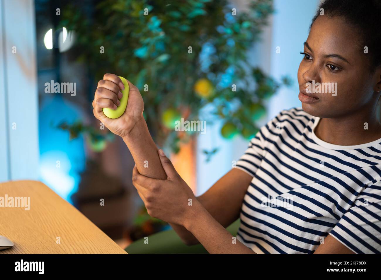 Female hand exercising with silicone grip ring for hand flexibility and ...