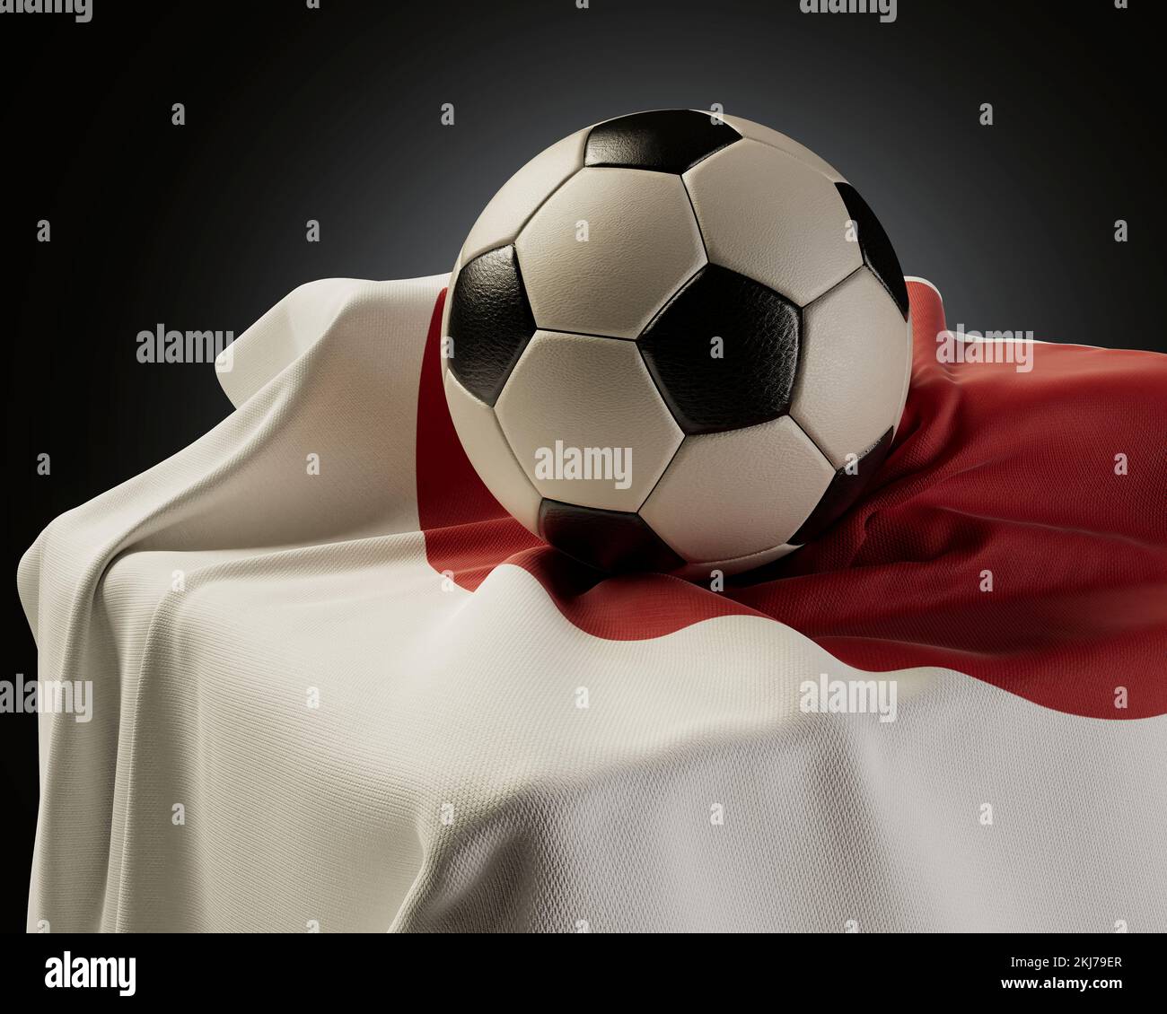 A regular soccer ball resting on a Japan flag draped over a plinth on ...