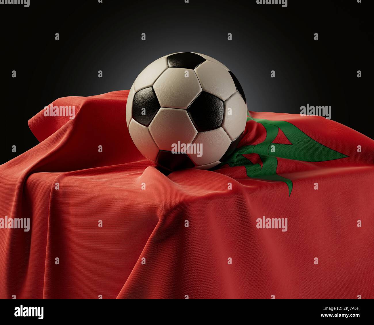A regular soccer balls resting on a Morocco flag draped over a plinth ...