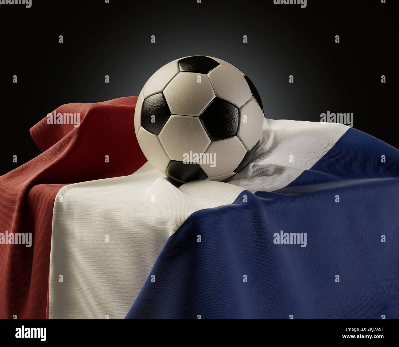 A regular soccer balls resting on a Netherlands flag draped over a ...