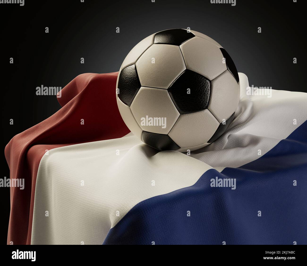 A regular soccer balls resting on a Netherlands flag draped over a ...