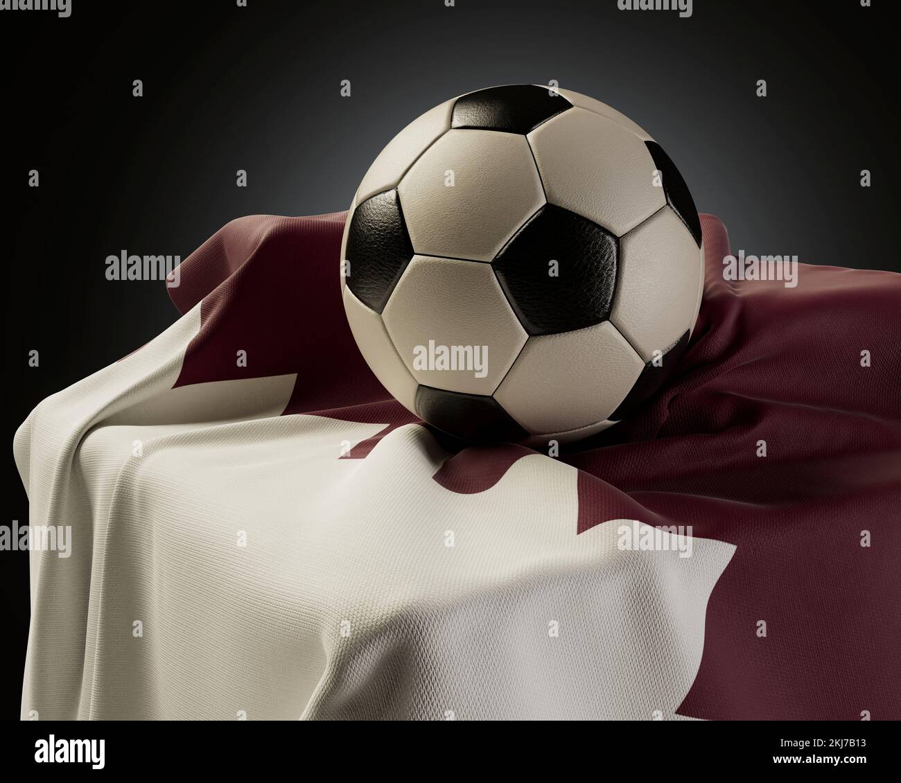 A regular soccer balls resting on a Qatar flag draped over a plinth on ...