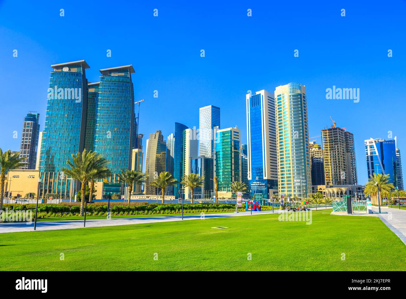Doha, Qatar - February 20, 2019: landscape with palm trees of new ...