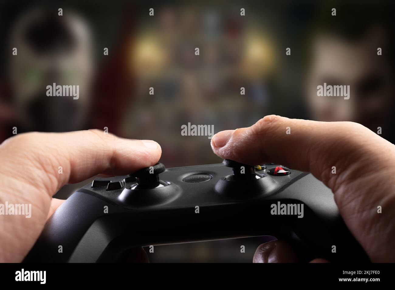 Close-up. A modern joystick in the hands of a gamer against the ...