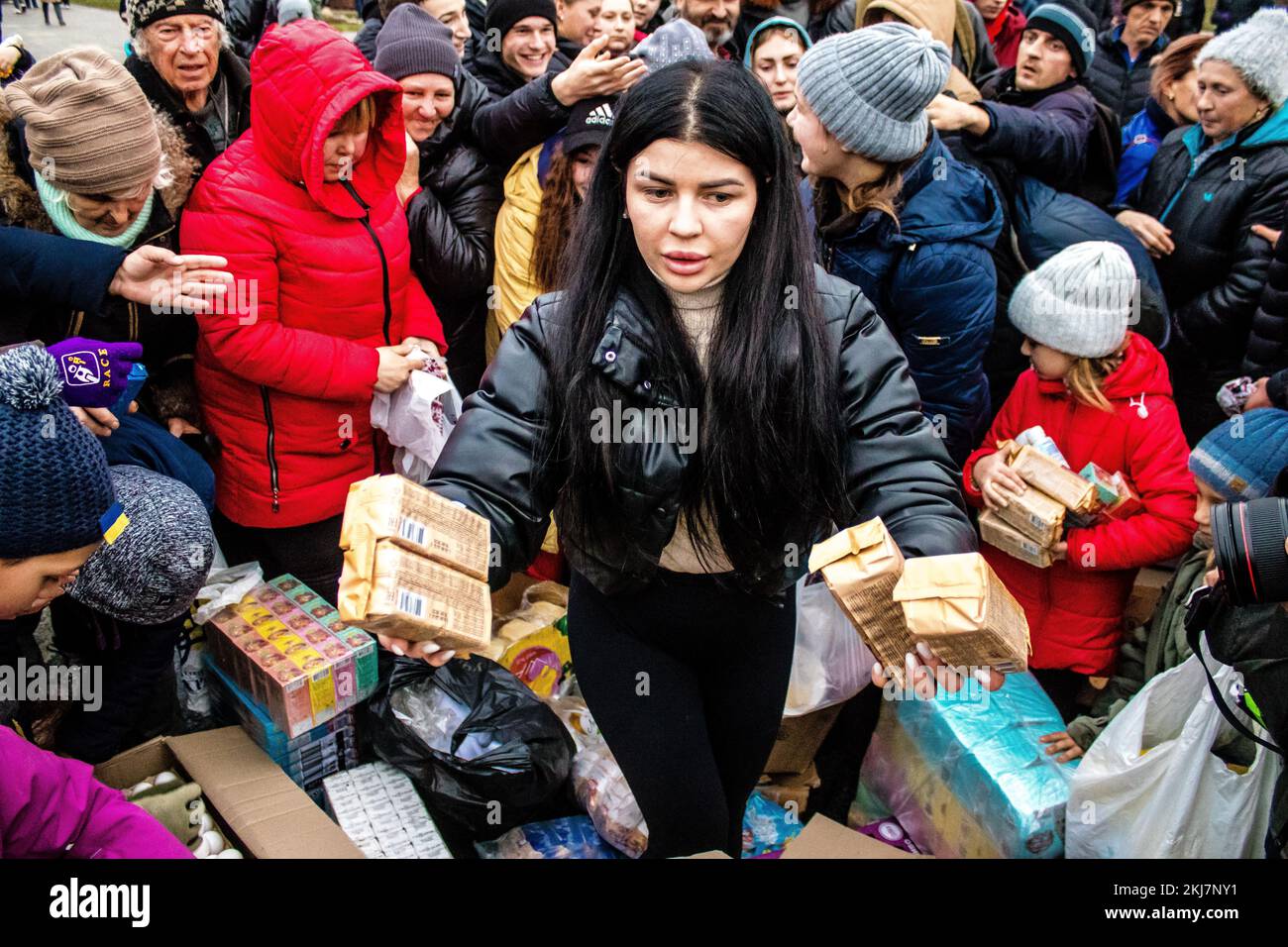 Residents of Kherson, Ukraine, receive food supplies in Freedom Square ...
