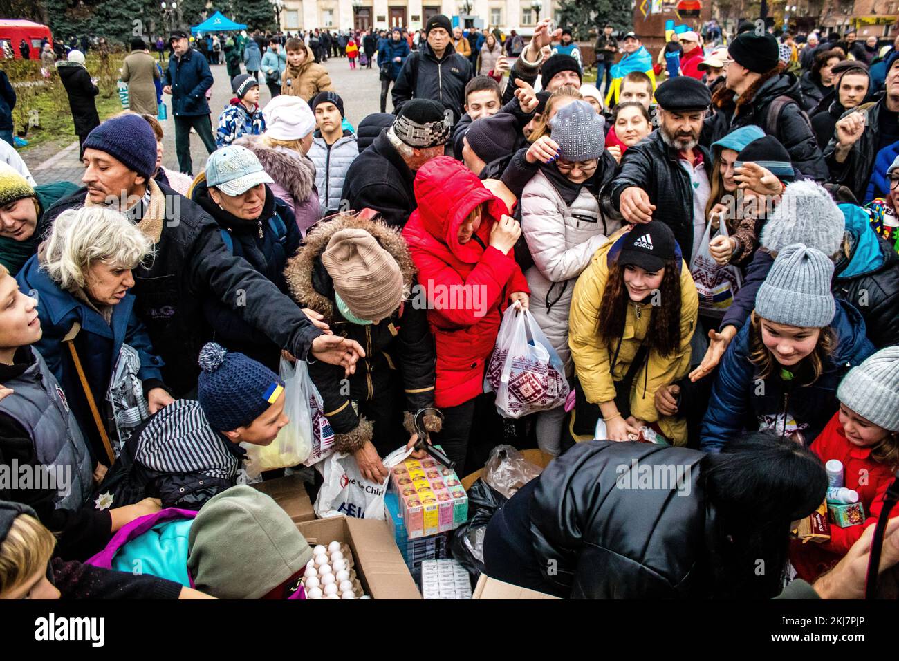 Residents of Kherson, Ukraine, receive food supplies in Freedom Square ...