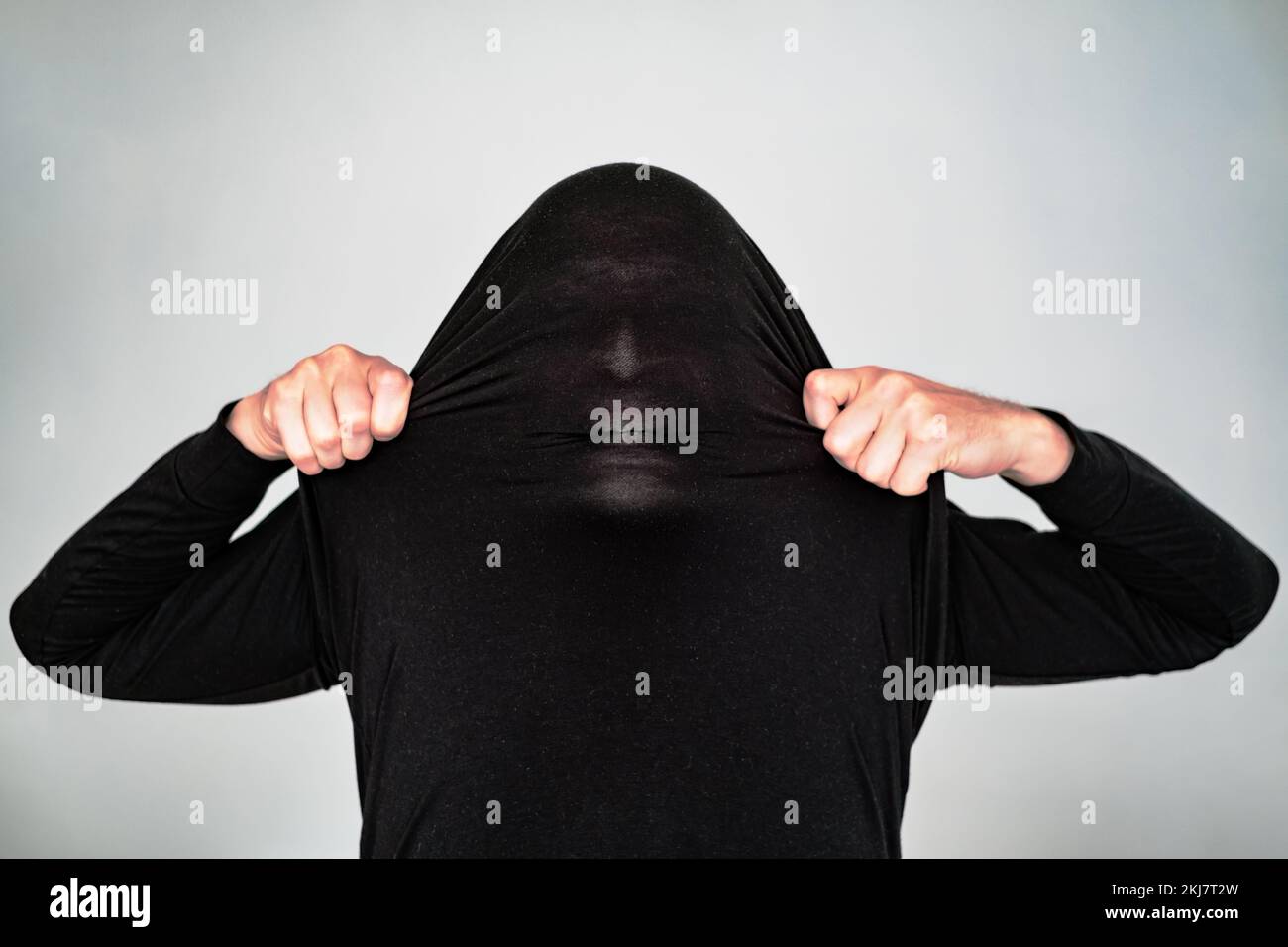 Male silhouette breaking through the fabric. Struggle and inner demon ...