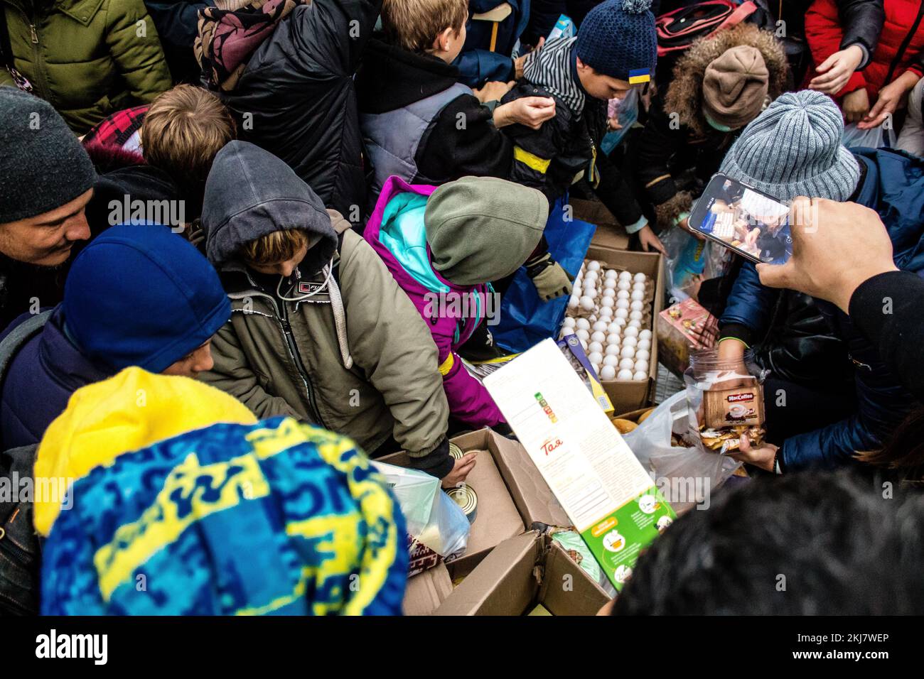 Residents of Kherson, Ukraine, receive food supplies in Freedom Square. The tension is very ...