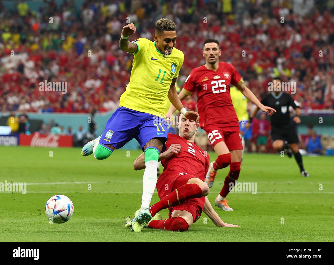 Doha, Qatar, 24th November 2022. Raphael Raphina of Brazil tackled by ...