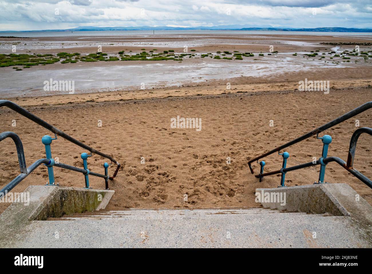 Concrete steps from Promenade to sandy beach Stock Photo - Alamy