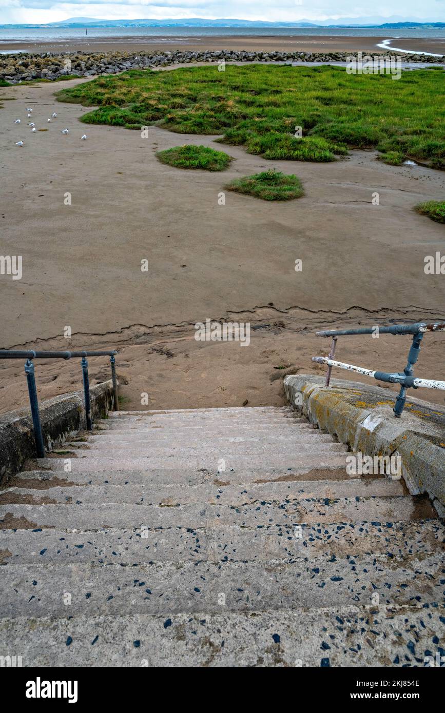 Concrete steps from Promenade to sandy beach Stock Photo - Alamy