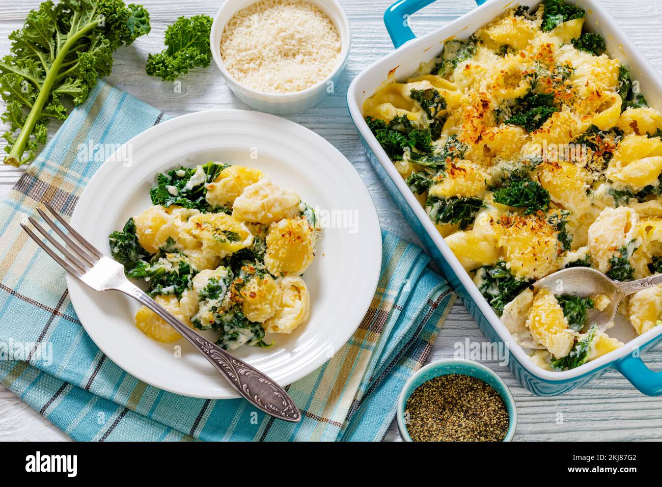 cheesy baked shell pasta with green leafy kale topped with crispy ...
