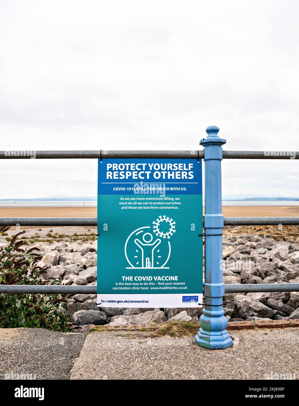 Covid precaution notice attached to railings on seafront Stock Photo ...