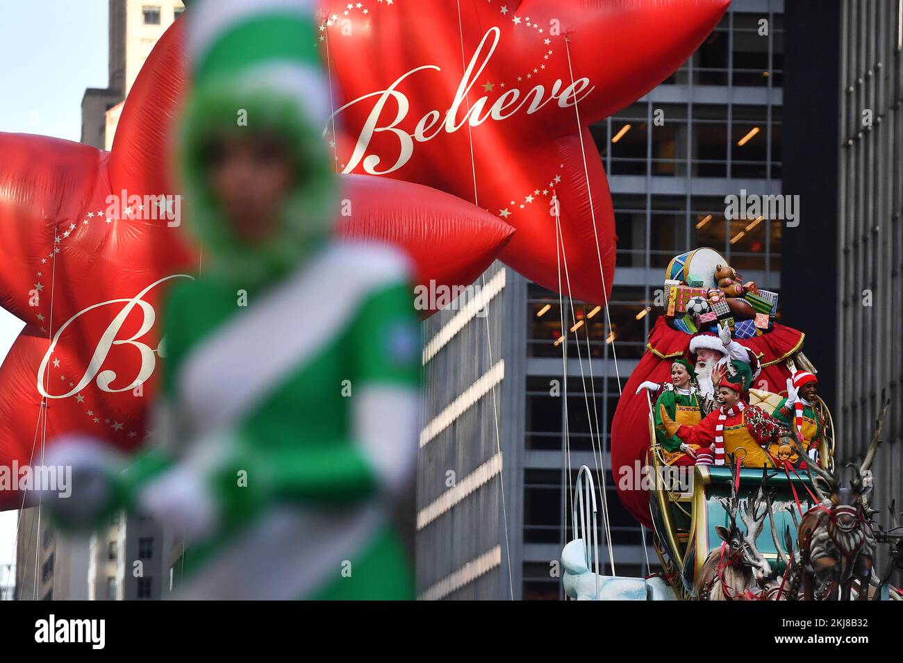 Santa Clause And His Elves Ride Down Avenue Of The Americas During The