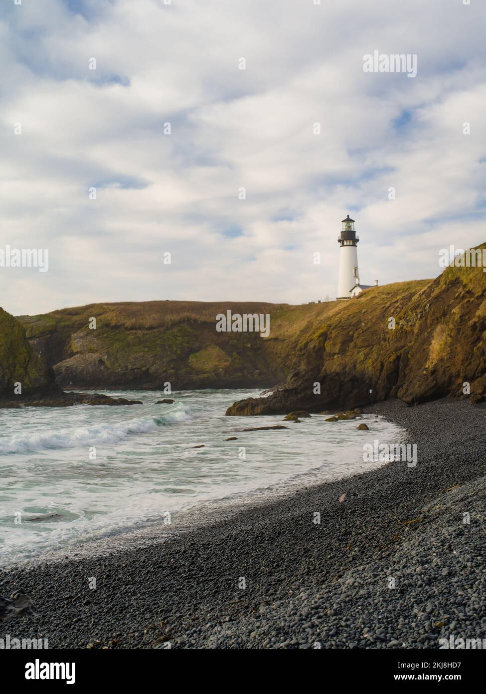 Beautiful seascape. Lonely white lighthouse on the high shore of the ...