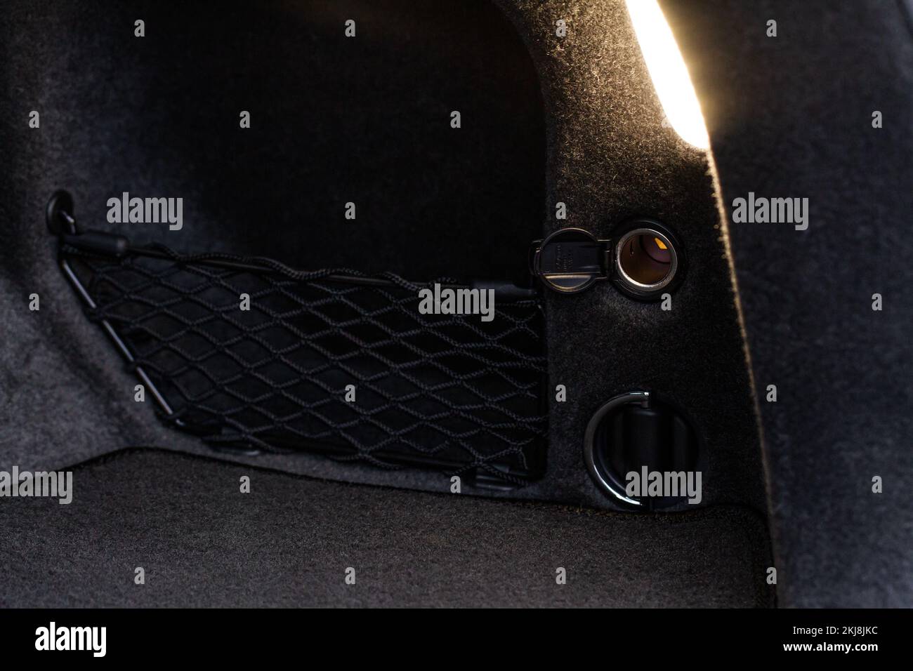 The luggage net inside modern car trunk Stock Photo - Alamy