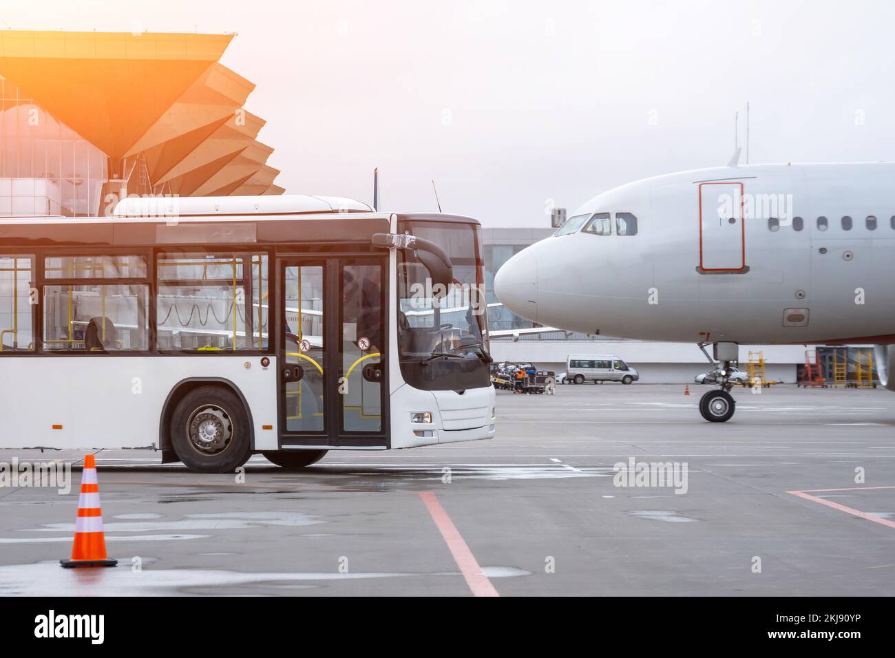 Bus to transport passengers to the aircraft, and the airplane. Nose to ...
