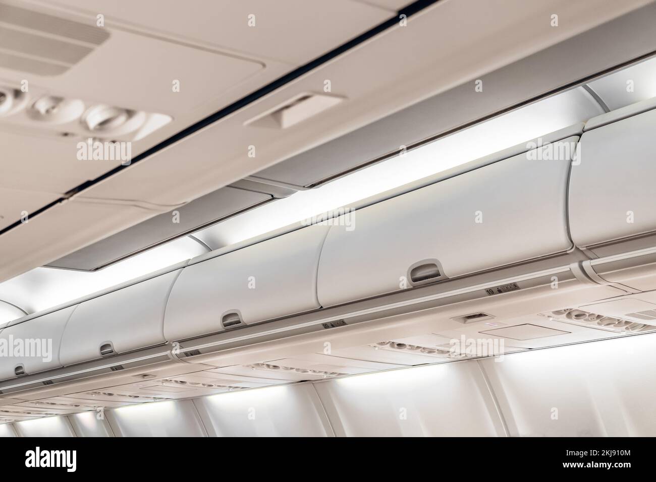 Closed doors luggage shelves in economy class passenger aircraft Stock ...