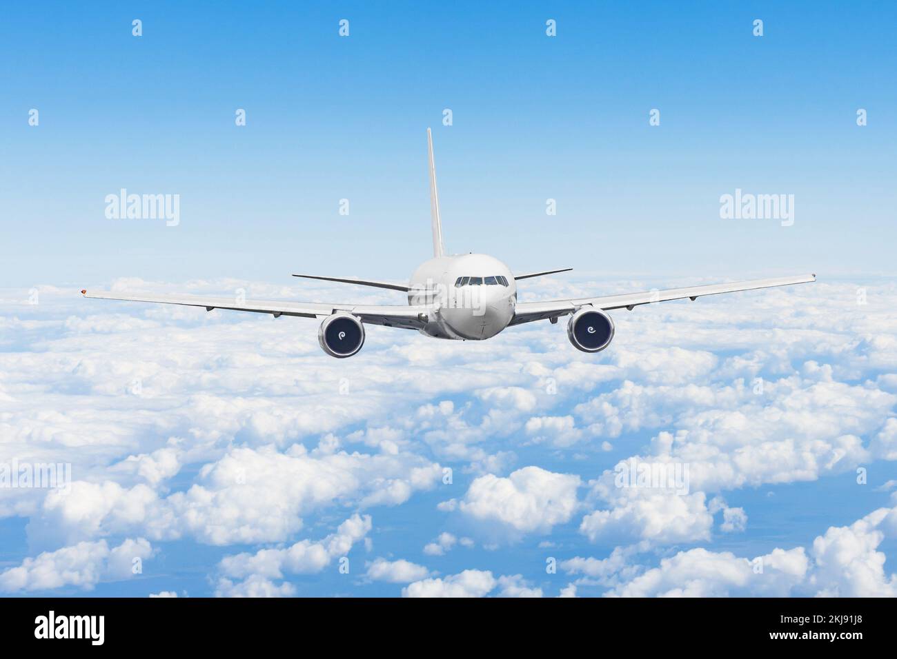 Aircraft fly high in the sky above the summer clouds Stock Photo - Alamy