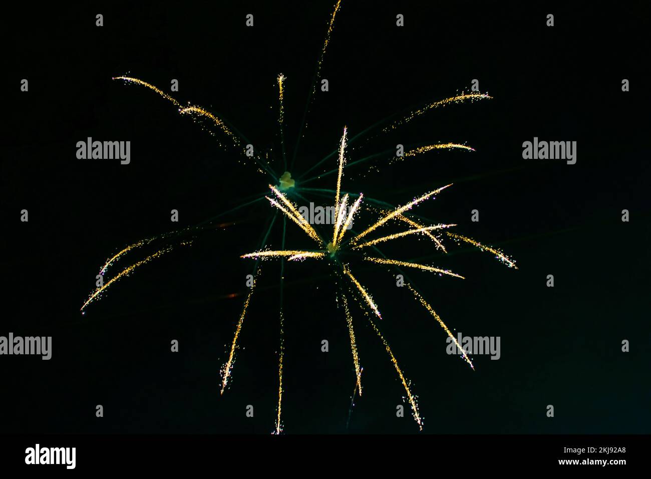 An explosion of bright single fireworks, against the background of the ...