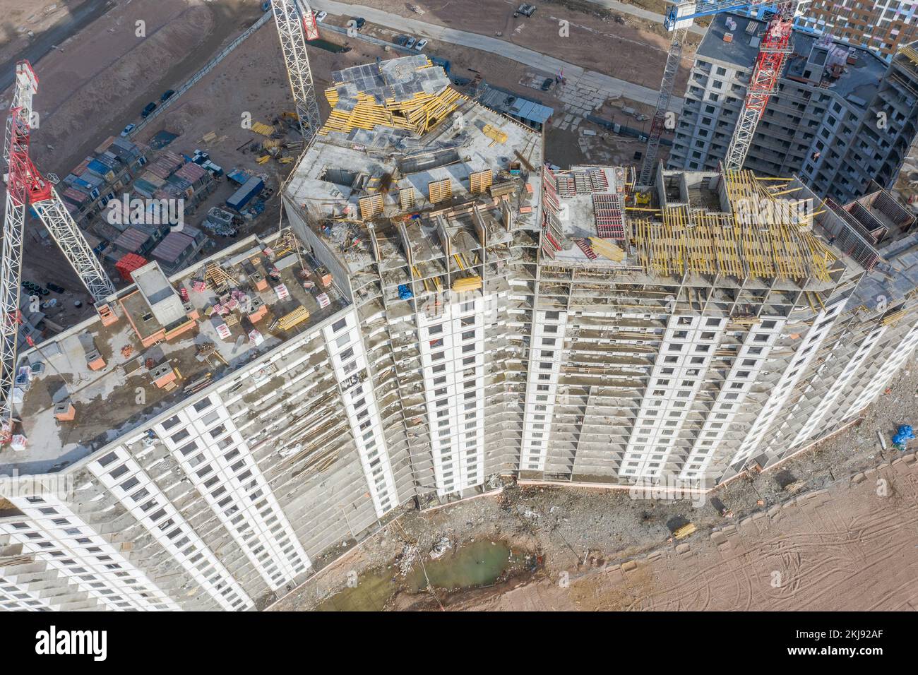 Aerial top view of high-rise residential buildings under construction ...