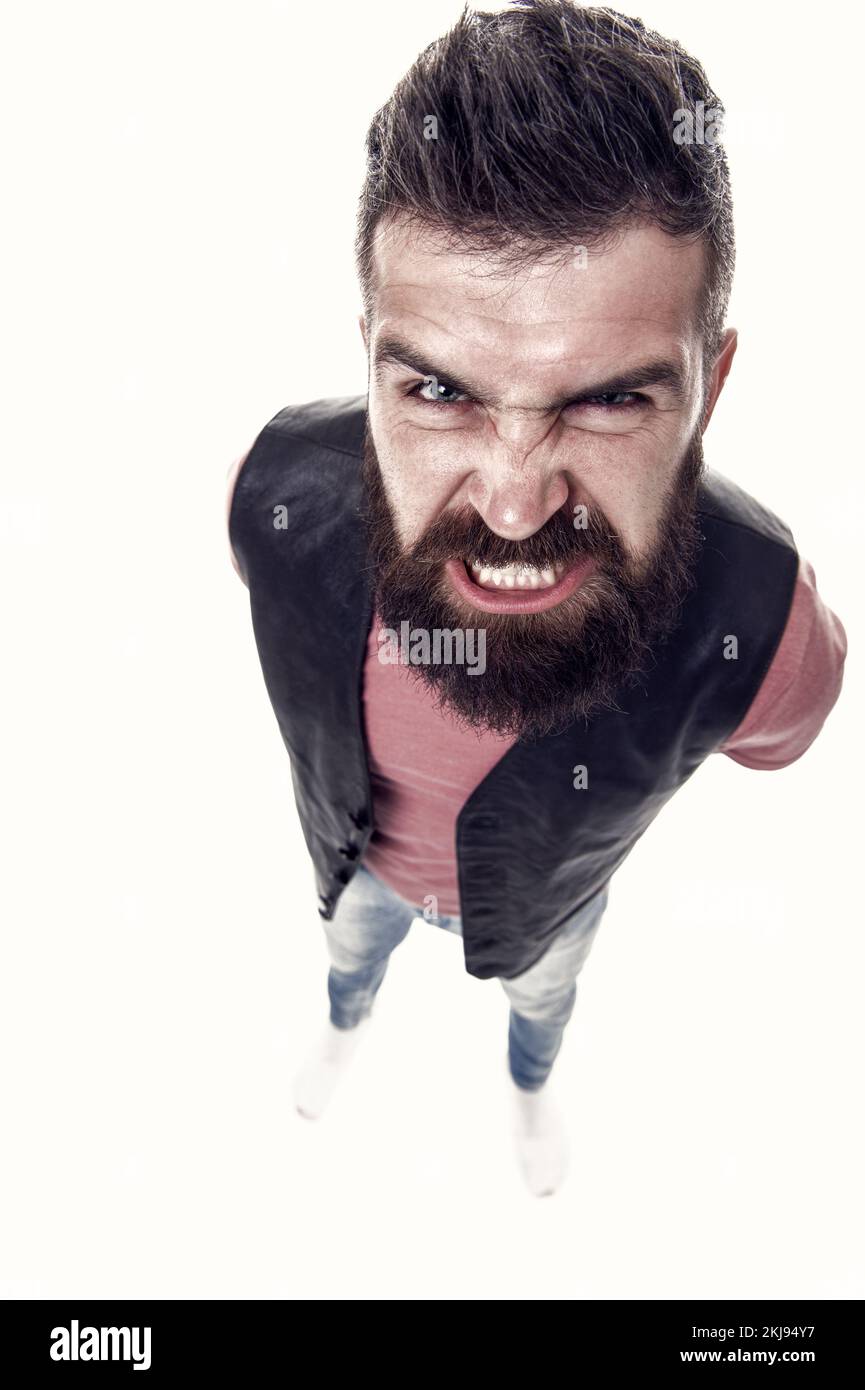 Extremely mad. Man aggressive face expression stand white background ...